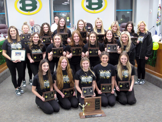 School board approves superintendent contract, honors cheerleaders ...
